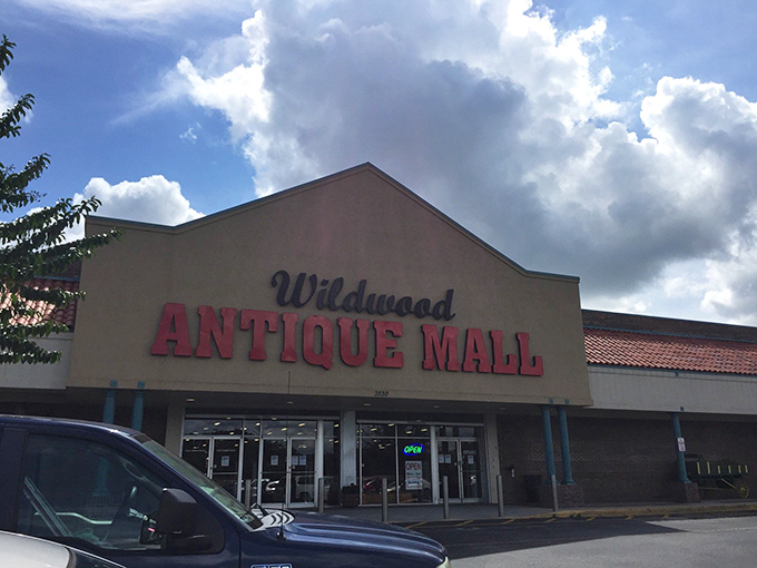 At Wildwood Antique Mall, even the clouds seem to gather in anticipation of the wonders inside. One modest entrance, thousands of stories waiting to be discovered.