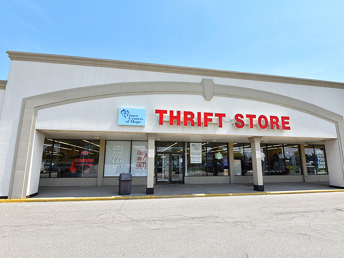 Bright blue skies complement the clean storefront design. Like a retail mullet&mdash;business in the front, thrifting party inside!