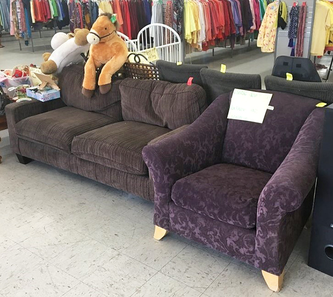 Where one person's discarded sectional becomes another's conversation piece, complete with a stuffed horse guardian overseeing all furniture transactions.