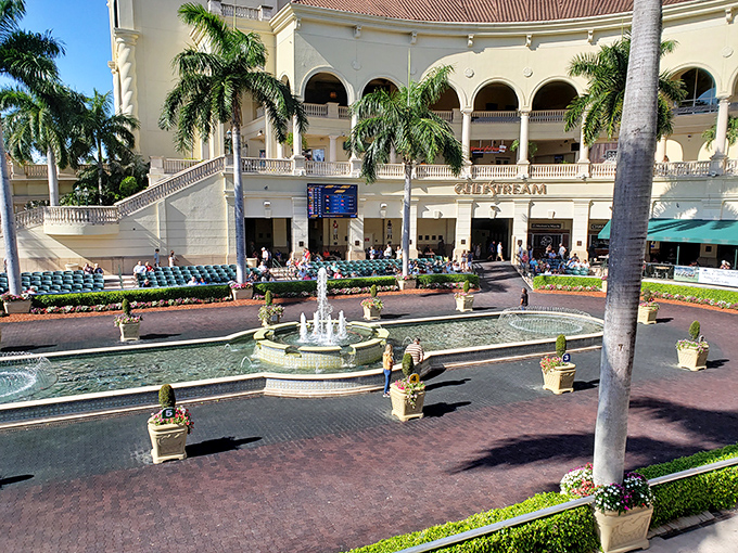 Mediterranean elegance meets Florida sunshine at Gulfstream Park, where racing fans gather beneath palm trees and arched colonnades.