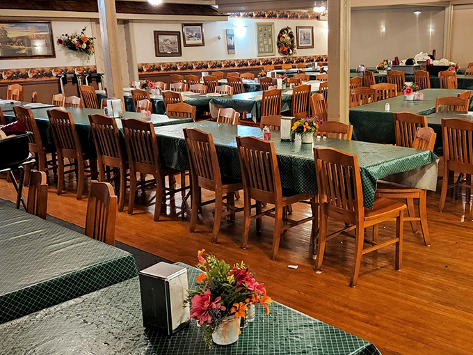 Family-style dining at its finest. The wooden chairs and green tablecloths create the perfect backdrop for memory-making meals that taste like childhood.