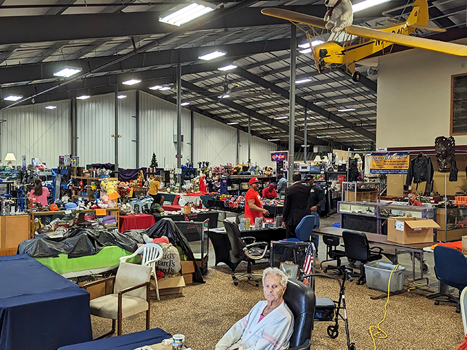 Look up and you'll spot model airplanes soaring above the organized chaos of vendor displays, serving as whimsical landmarks for lost shoppers.