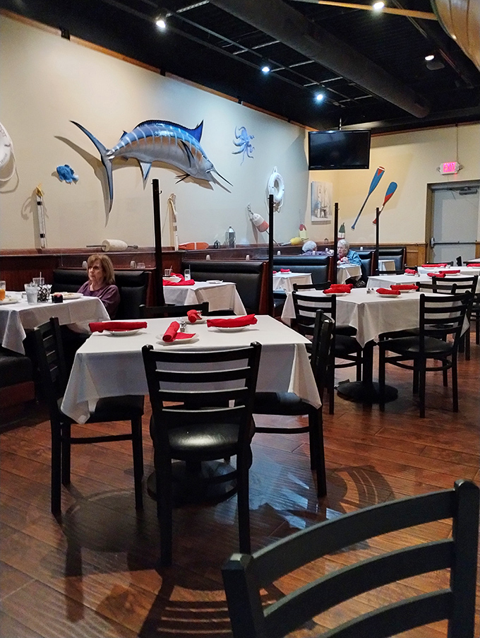 Nautical charm meets Midwest hospitality inside, where marlin mounts and oars create an atmosphere that whispers, "Yes, we know our seafood."
