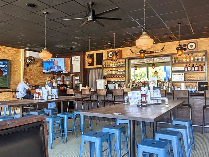 Industrial chic meets Southern comfort in Heavy's dining room. Those blue metal stools aren't just stylish&mdash;they're perfectly positioned for maximum burger-to-mouth efficiency.