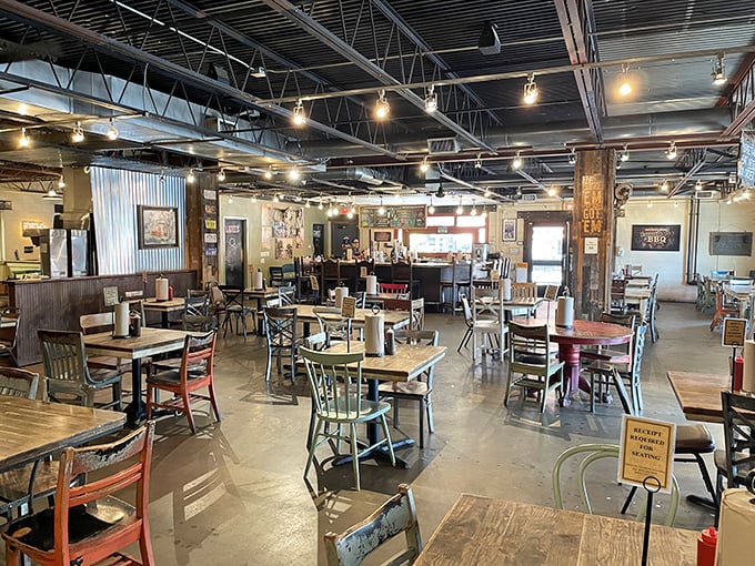 Industrial chic meets Texas comfort in this spacious dining room where strangers become friends united by the universal language of great barbecue.