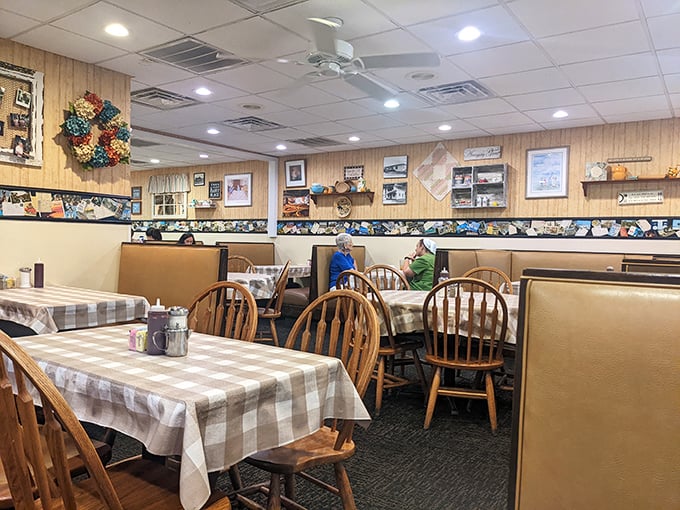 Wood paneling, checkered tablecloths, and Windsor chairs—this isn't interior design, it's a time machine to when comfort meant more than Instagram likes.