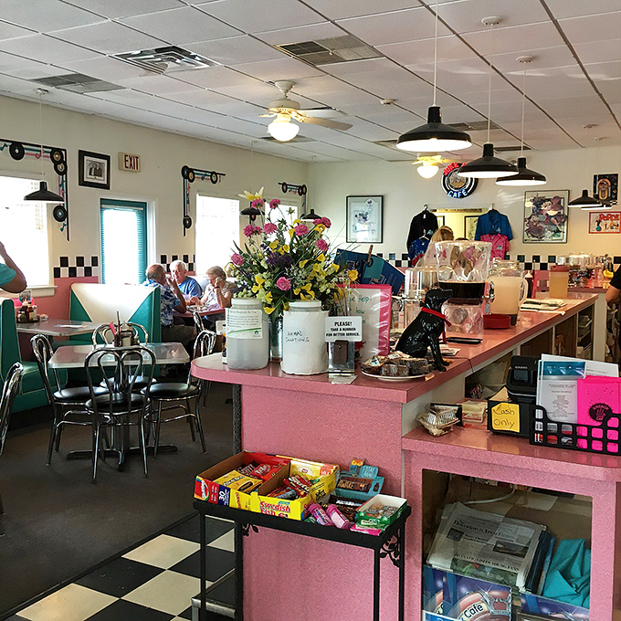 Pink countertops and checkered floors transport you to a bygone era where conversation flows as freely as the coffee.