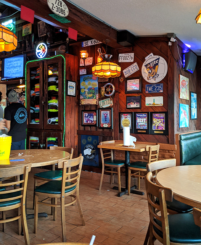License plates, neon signs, and decades of memories line these wood-paneled walls. It's like dining inside a scrapbook of good times that smells like butter and Old Bay.