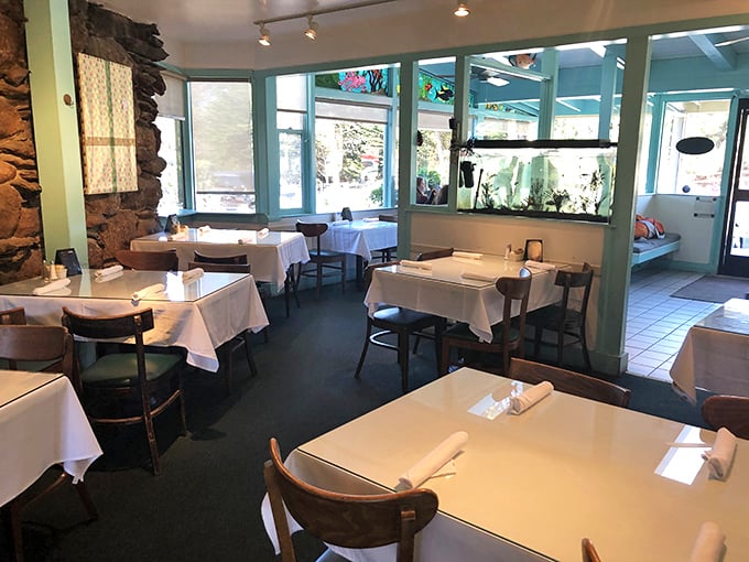 White tablecloths meet coastal charm in this dining room where the seafood, not the decor, does the showing off. Stone walls whisper tales of Pacific storms.