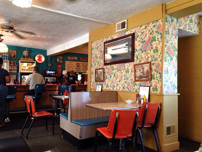 Inside, time stands still with vintage booths, floral wallpaper, and orange vinyl chairs that have cradled hungry Akronites for generations.