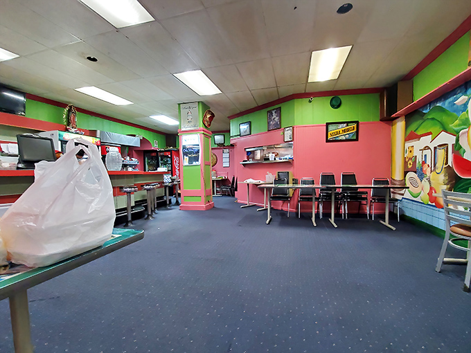 Vibrant pink and green walls create an atmosphere that's part fiesta, part family dining room. It's like stepping into a colorful postcard from Mexico.