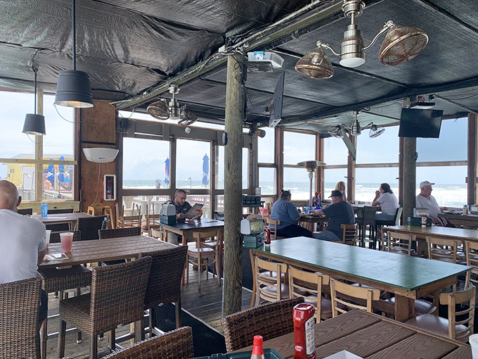 Floor-to-ceiling windows transform ordinary dining into an immersive ocean experience. Even the most boring conversation becomes fascinating with this backdrop.