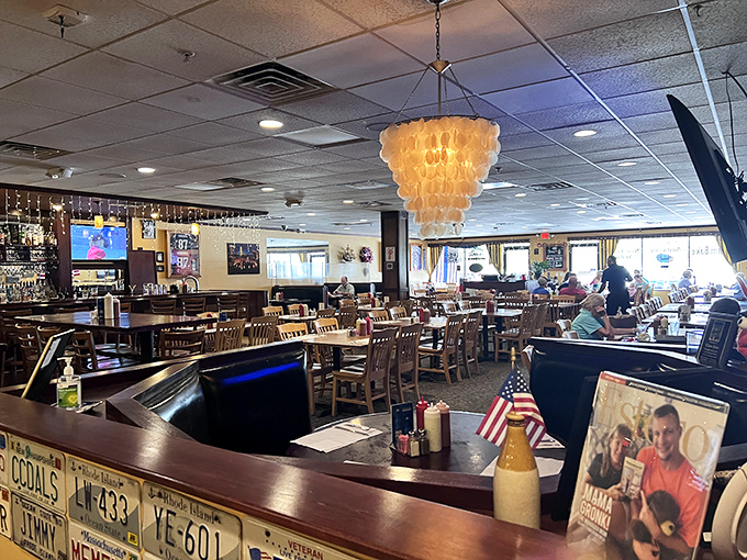 Step inside and you're transported north—the capiz shell chandelier and license plate-adorned bar create that perfect "fancy casual" vibe every great seafood joint needs.
