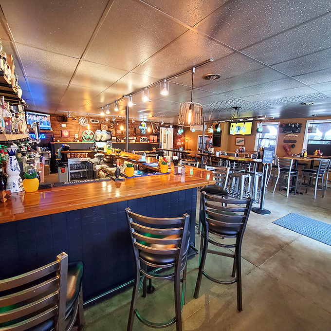 Inside, the warm wooden bar and industrial-chic seating create that perfect sweet spot between "neighborhood watering hole" and "place you'd happily bring your mother-in-law."