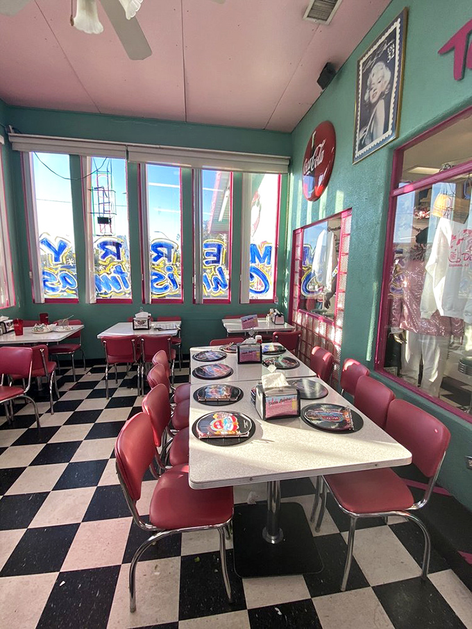 Classic black and white checkered floors meet cherry-red vinyl seating&mdash;this isn't decoration, it's a portal to 1955 with table service.