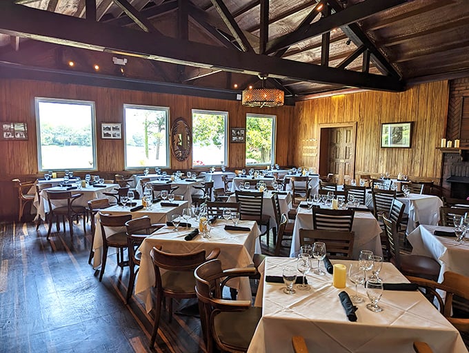 Warm wood paneling and white tablecloths create that perfect sweet spot between "special occasion" and "I could eat here every week."