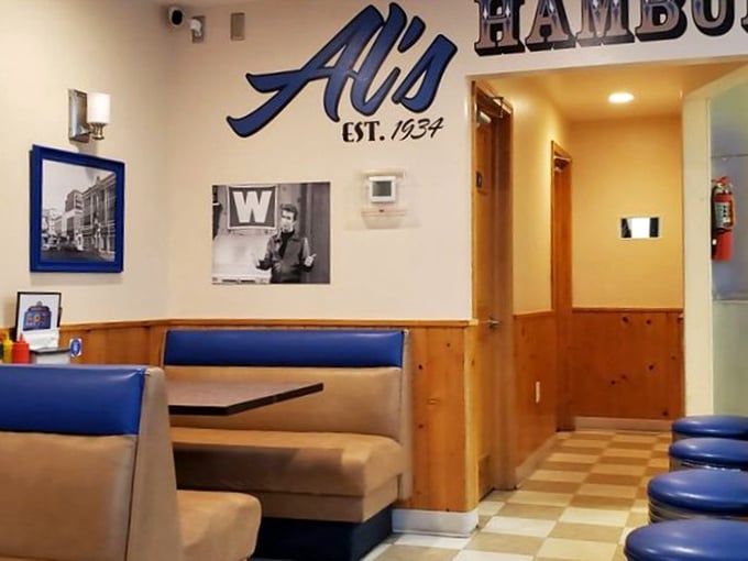 Blue vinyl booths and wood paneling create a time capsule where conversations about Packers legends and perfect burgers have flowed for generations.