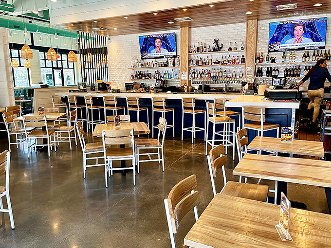 Inside, light wood meets white brick walls in a space that feels both upscale and approachable—like your fancy friend who still laughs at dad jokes.