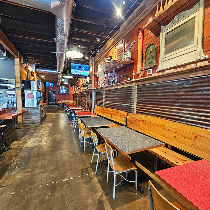 Inside, rustic wood meets industrial chic with corrugated metal accents. This isn't fine dining—it's something better: a temple to seriously good chicken.