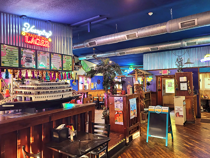 Step inside and you're transported to a nautical wonderland where corrugated metal, neon beer signs, and maritime decor create an atmosphere that's equal parts Midwest and coastal getaway.