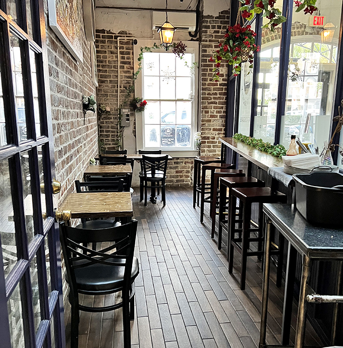 Exposed brick walls and wooden floors create a cozy British hideaway that's part London café, part Savannah charm.