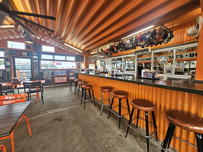 Step inside and the warm wooden paneling, chrome stools, and baseball cap collection instantly transport you to simpler times. Comfort food's natural habitat.