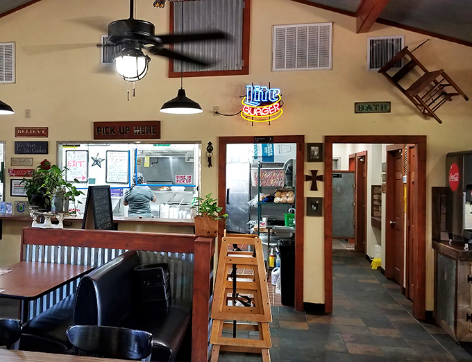 Inside, corrugated metal meets homey charm with a "Pick Up Here" sign that might as well read "Happiness Collected Here" for hungry Texans.