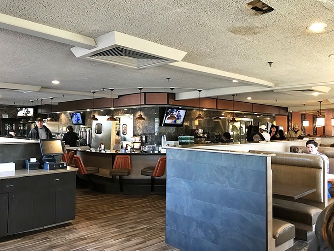 Inside, the classic diner layout invites you to slide into a booth or perch at the counter, where breakfast dreams come true and coffee cups never stay empty.