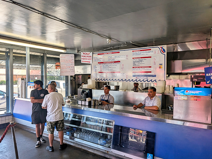 Where seafood dreams come true. The ordering counter at Fisherman's Outlet operates with the precision of a well-oiled galleon, efficiently serving eager customers.