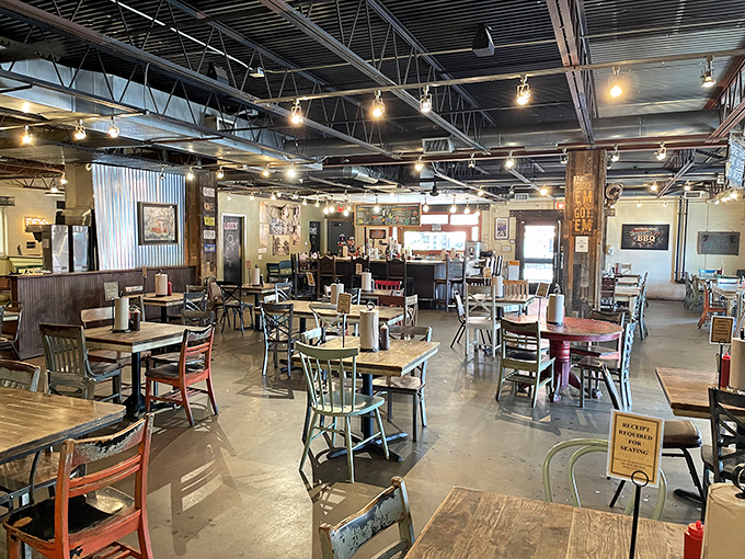Industrial meets rustic in this inviting dining space where strangers become friends united by the universal language of exceptional barbecue.