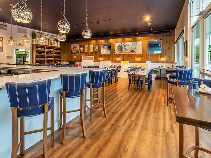Warm wood, nautical blues, and those mesmerizing pendant lights create the perfect backdrop for seafood indulgence without a hint of pretension.
