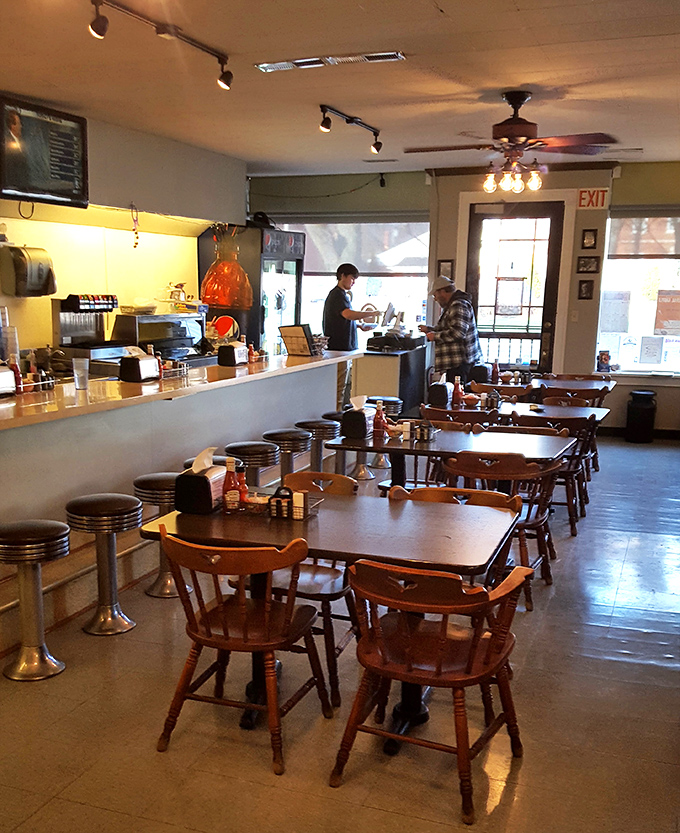 Classic wooden chairs and counter seating create that "everybody knows your name" vibe where regulars and newcomers alike feel instantly at home.