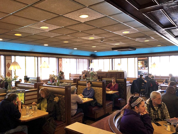 Classic diner geometry at its finest&mdash;booths filled with regulars, pendant lights casting a warm glow, and conversations flowing as freely as the coffee.