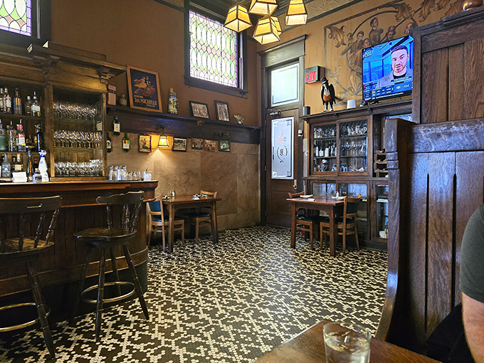 Step inside and the mosaic floor tiles tell stories of a century's worth of footsteps. The warm wood and stained glass windows whisper "stay awhile."