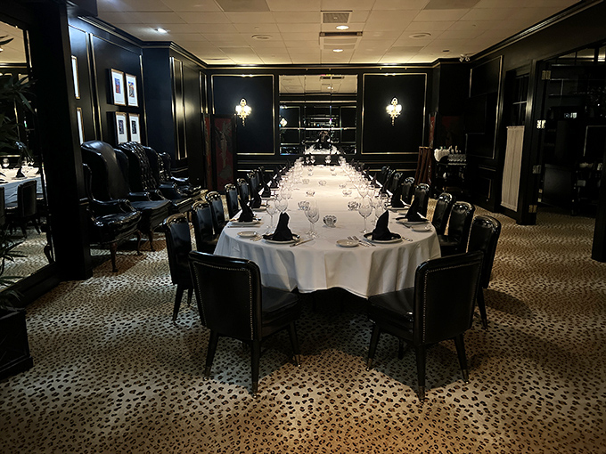 Dark wood, crisp linens, and leopard-print flooring&mdash;this private dining space whispers "special occasion" before you've even ordered a drink.