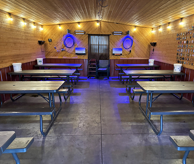 Inside, wooden walls and picnic tables create a cozy retreat where the only thing more satisfying than the ambiance is what's on your plate.