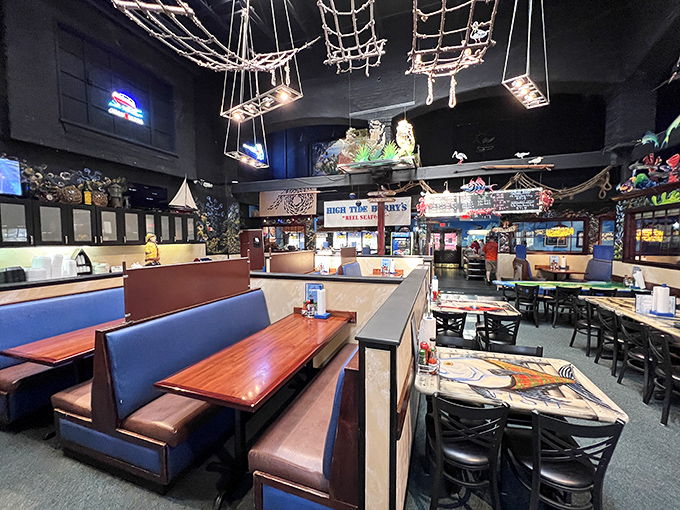 Fishing nets suspended from the ceiling create an underwater ambiance that sets the perfect stage for seafood indulgence.