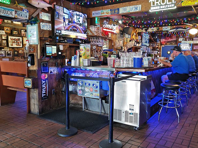 License plates, neon signs, and Christmas lights year-round – this isn't interior decorating, it's a visual autobiography of Florida's beloved seafood institution.