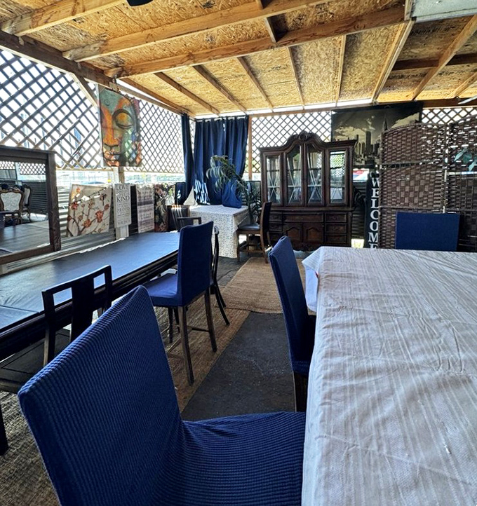 Lattice walls and blue chairs create a homey patio dining experience where conversations flow as freely as the sweet tea.