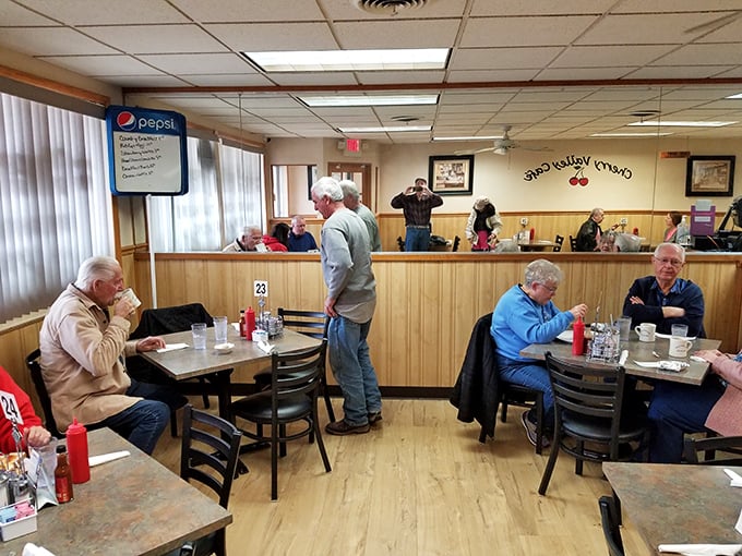 Morning regulars claim their usual spots in wood-paneled booths, where coffee flows freely and everyone seems to know everyone else's breakfast order.