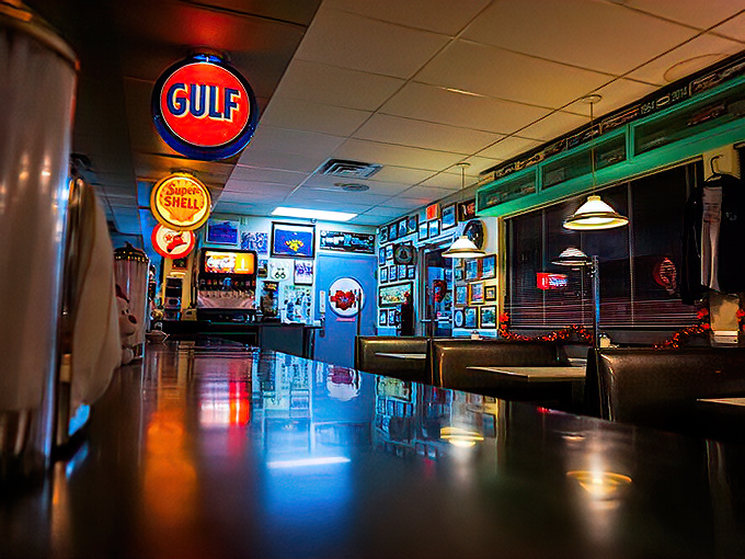 Step inside and suddenly you're swimming in neon nostalgia, where vintage gas station signs illuminate conversations that haven't changed much since Eisenhower was president.