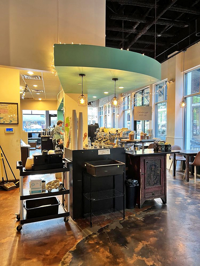 Inside, mint green accents and warm yellow walls create the perfect backdrop for that "I could stay here all day" feeling.