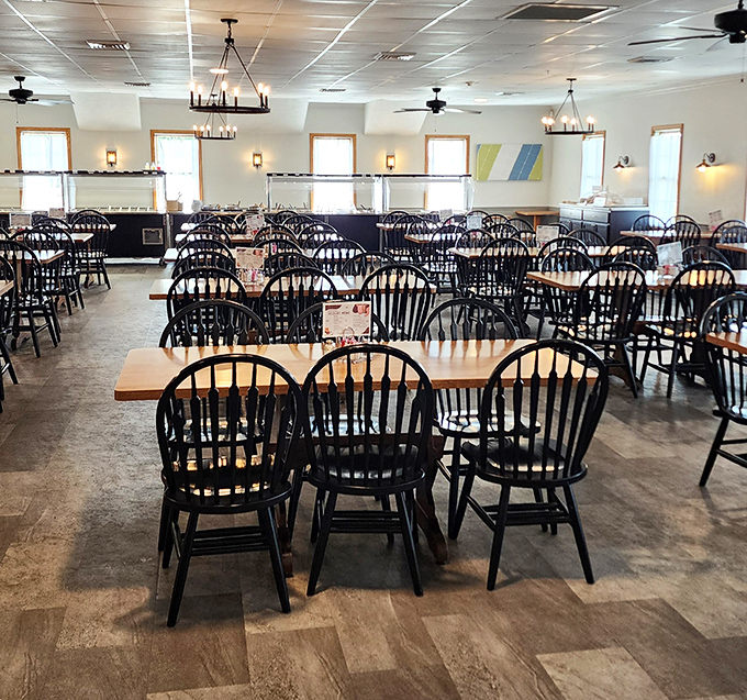Black Windsor chairs and simple wooden tables create an atmosphere of honest comfort. No pretension here&mdash;just a space designed for the serious business of enjoying good food.