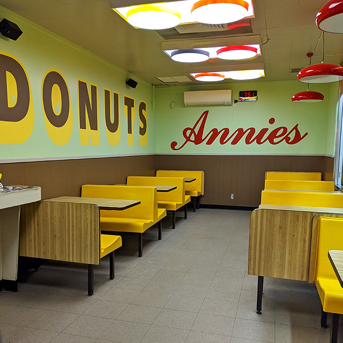 Step into donut heaven where yellow booths and green walls create pure breakfast bliss.