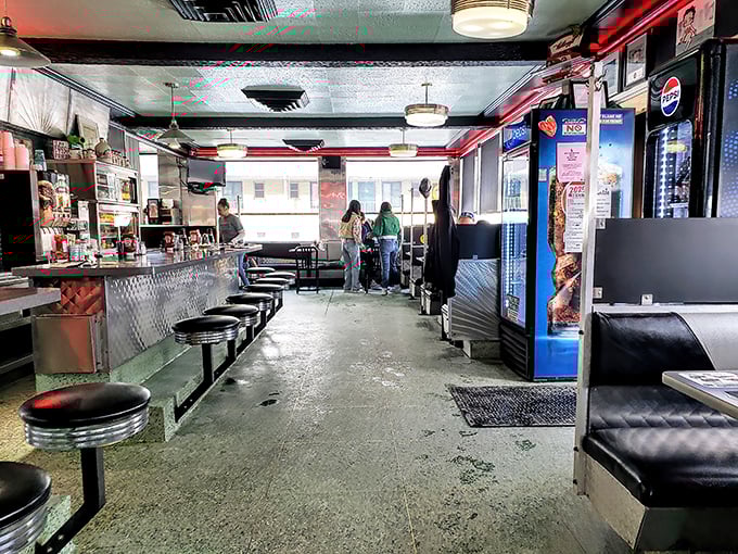 Where conversations flow as freely as the coffee. The counter-and-booth setup hasn't changed in decades because perfection needs no updating.