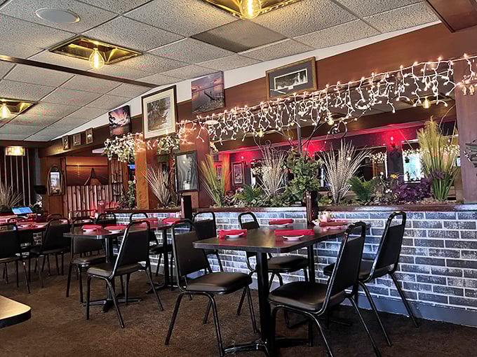 String lights twinkle year-round above brick walls and red accents, creating that warm Wisconsin supper club glow that no Instagram filter could ever replicate. 