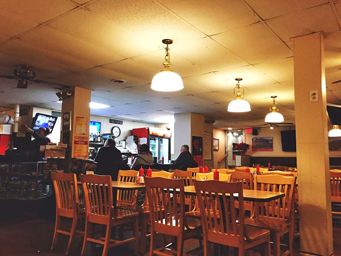 No designer chandeliers or trendy Edison bulbs here—just honest lighting over wooden tables where food, not decor, is the star attraction.