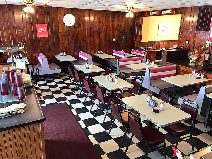 Classic wood paneling meets checkerboard floors in this time capsule of American dining. The pink booths have witnessed countless conversations and coffee refills.