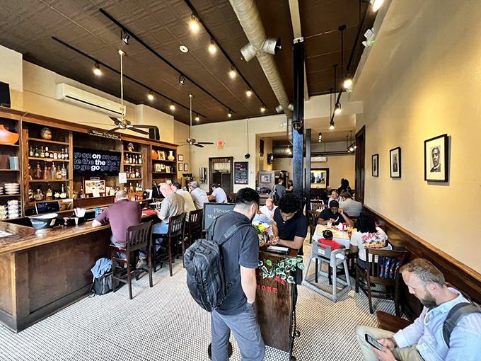 Inside, the warm wood tones and bustling atmosphere create that perfect "everybody knows your name" vibe. Southern hospitality in architectural form.