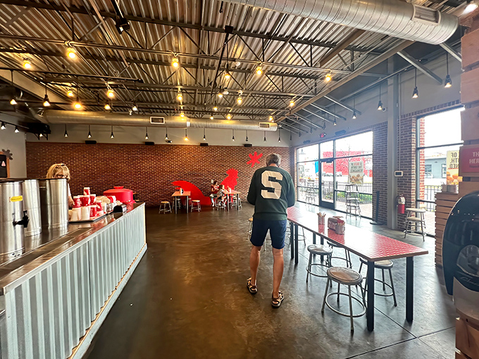 Industrial-chic meets comfort food haven – high ceilings, exposed ductwork, and communal tables where strangers become friends over shared spice adventures.